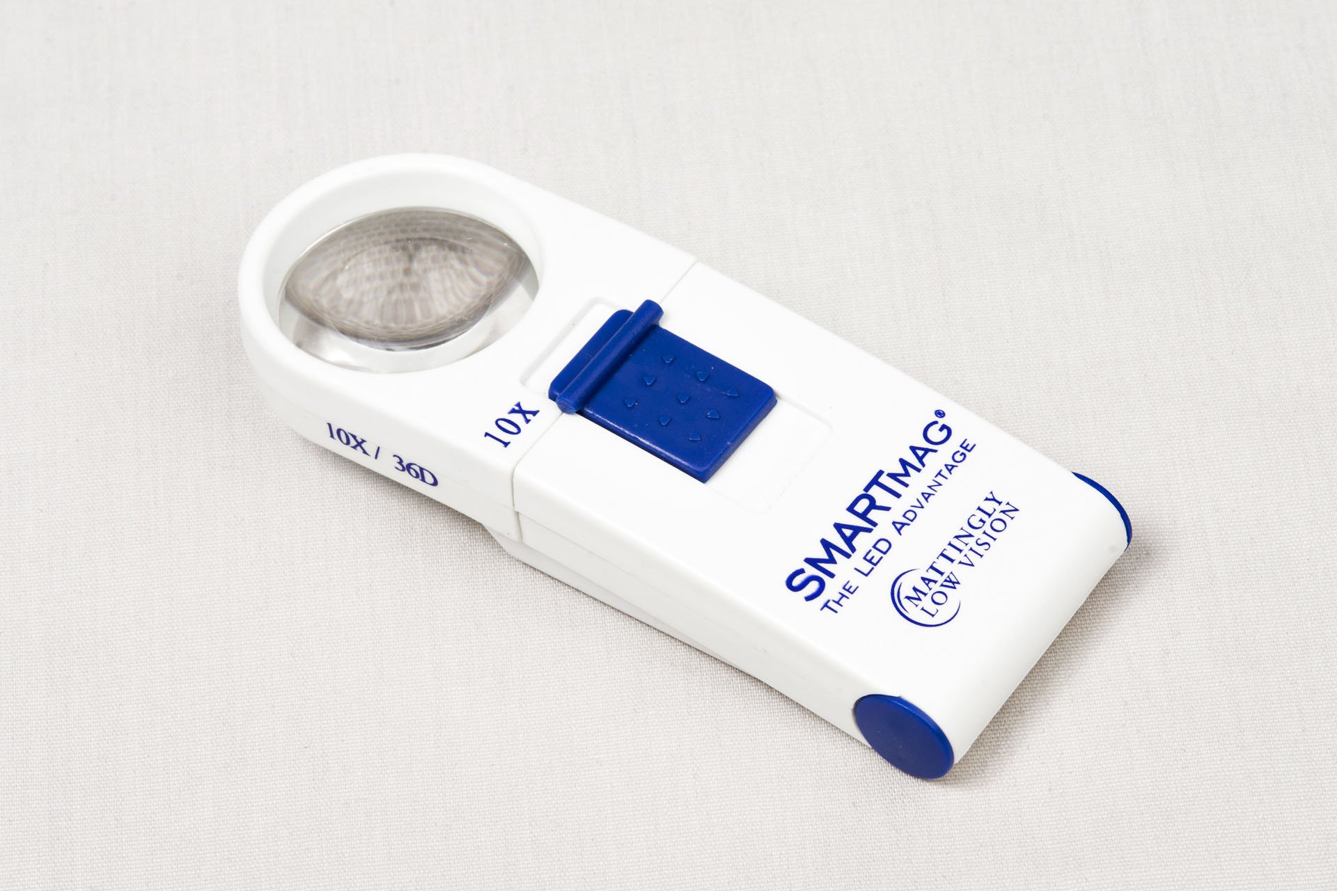SmartMag® 10X Teal LED Hand-Held Magnifier | Mattingly Low Vision, Inc.