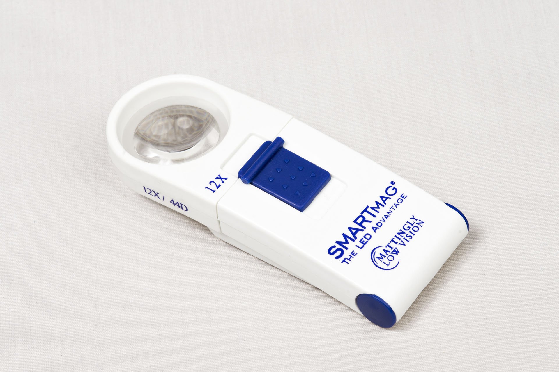 SmartMag® 12X Teal LED Hand-Held Magnifier | Mattingly Low Vision, Inc.