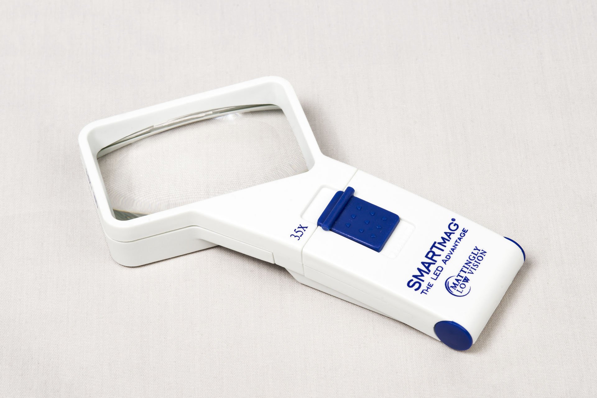 SmartMag® 3.5X Teal LED Hand-Held Magnifier | Mattingly Low Vision, Inc.